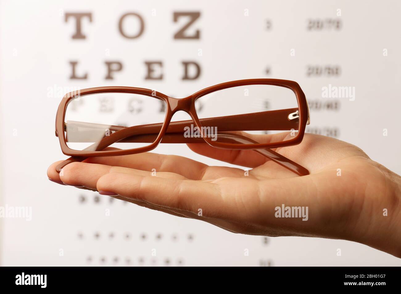 Eye glasses on eyesight test chart background Stock Photo - Alamy