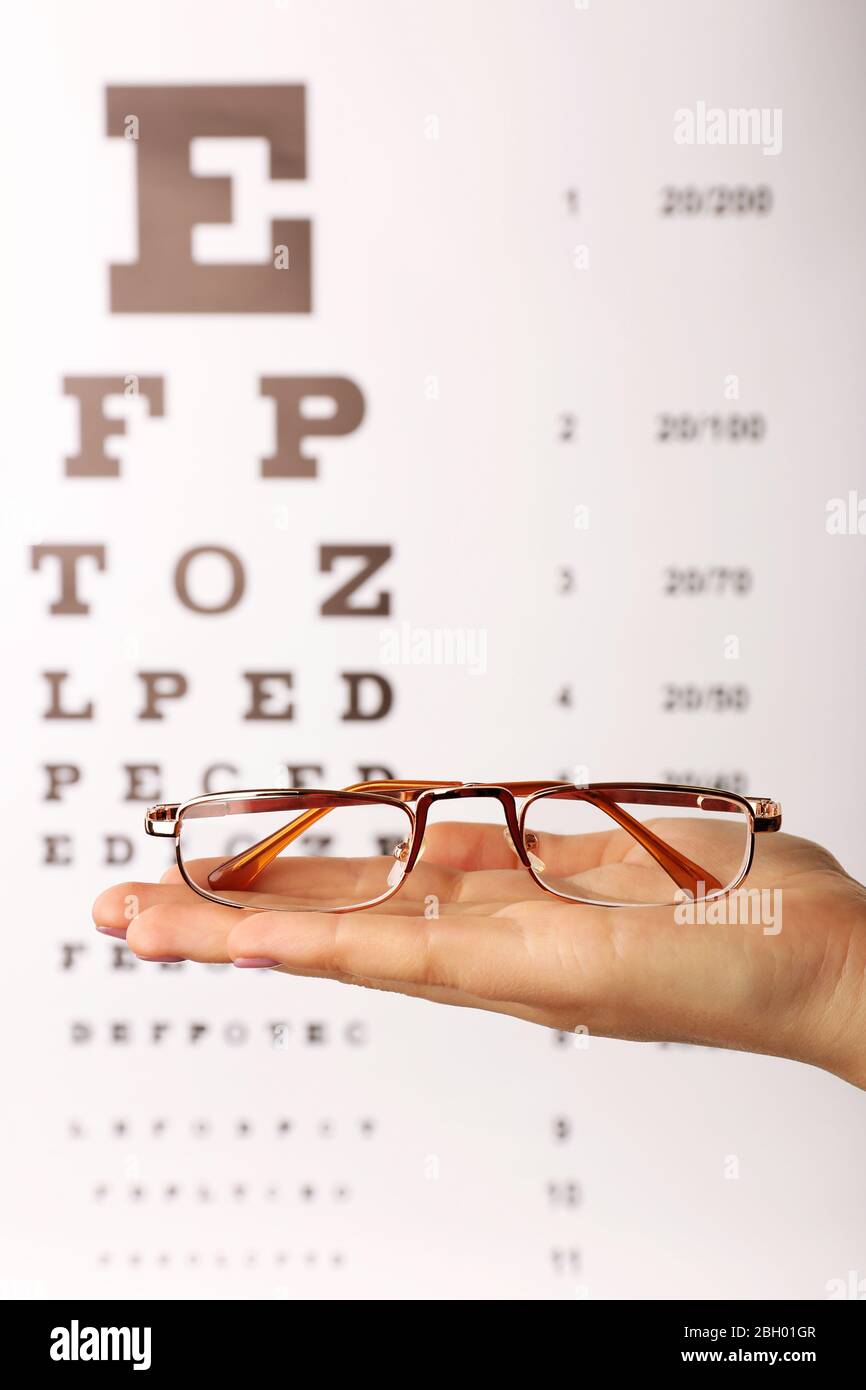 Eye glasses on eyesight test chart background Stock Photo - Alamy