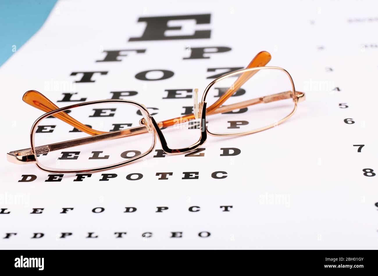 Eye glasses on eyesight test chart background Stock Photo - Alamy
