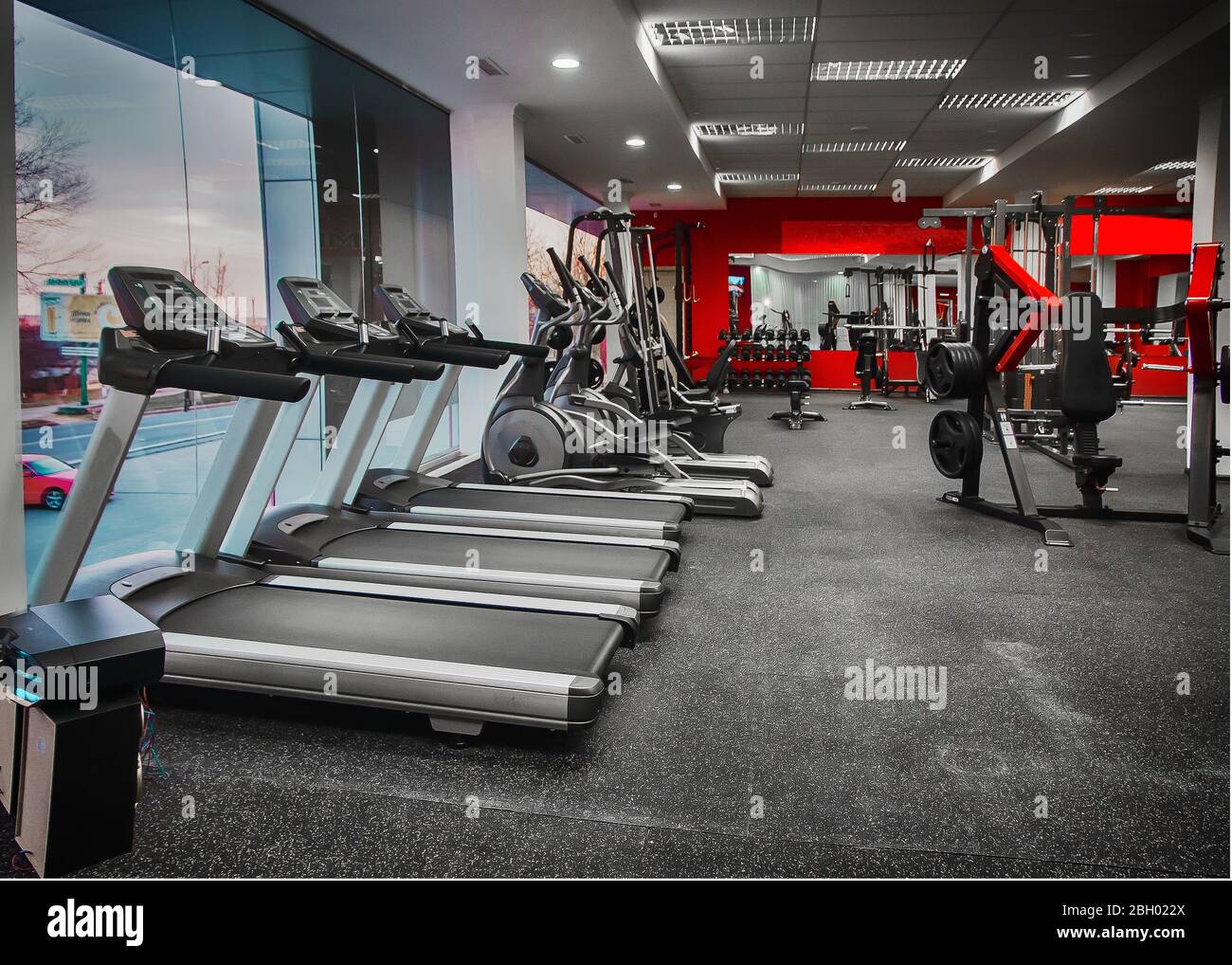 The modern red gym, Dumbbell and bodybuilding with various fitness ...