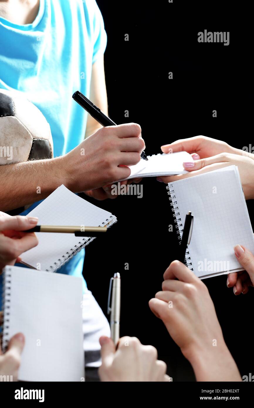 Autographs by football star on black and lights background Stock Photo ...