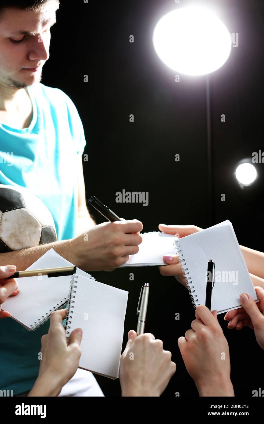 Autographs by football star on black and lights background Stock Photo ...