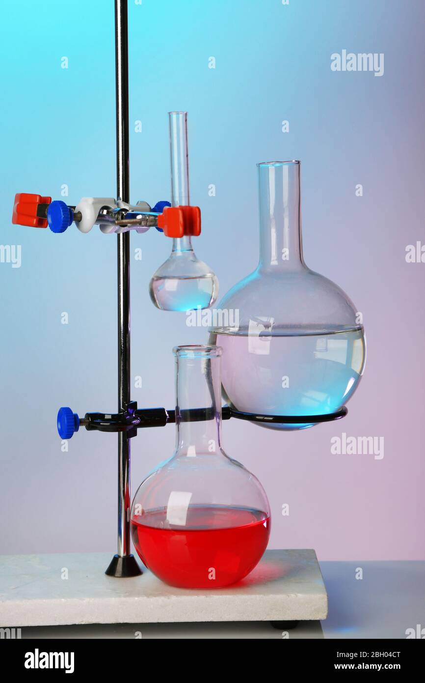 Fixed laboratory glassware on support on colorful background Stock ...