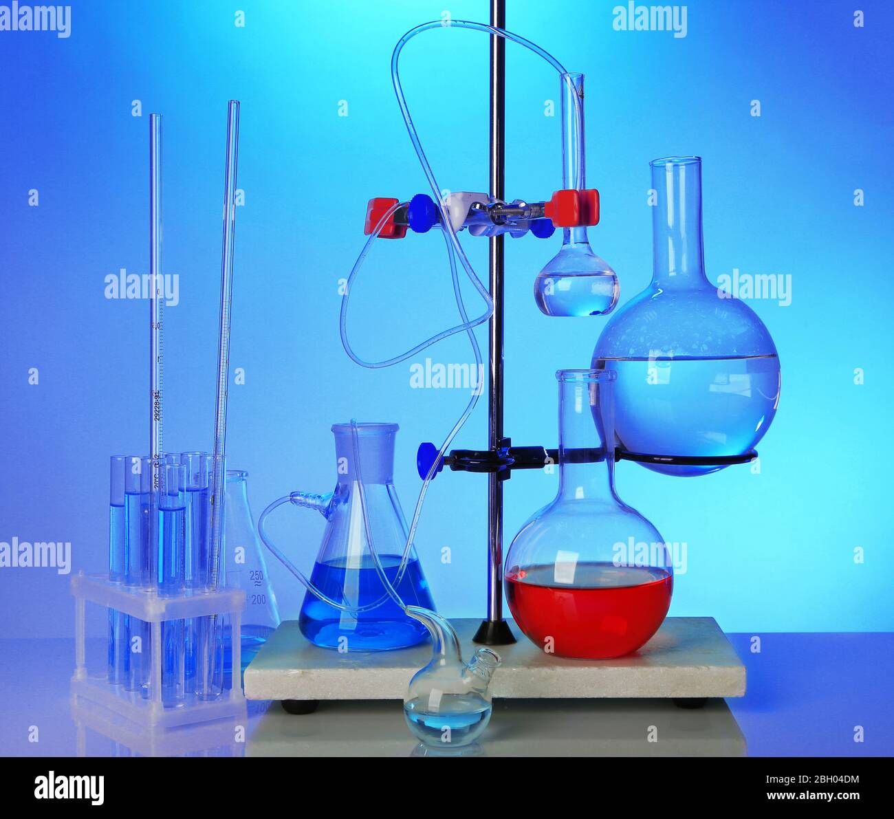 Fixed laboratory glassware on support on colorful background Stock ...