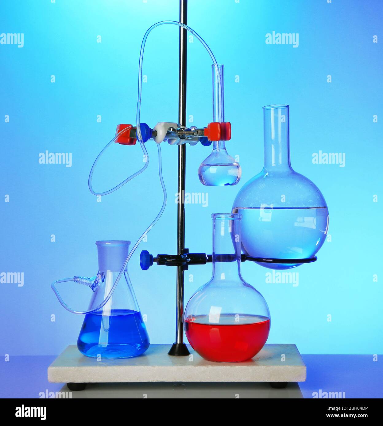 Fixed laboratory glassware on support on colorful background Stock ...