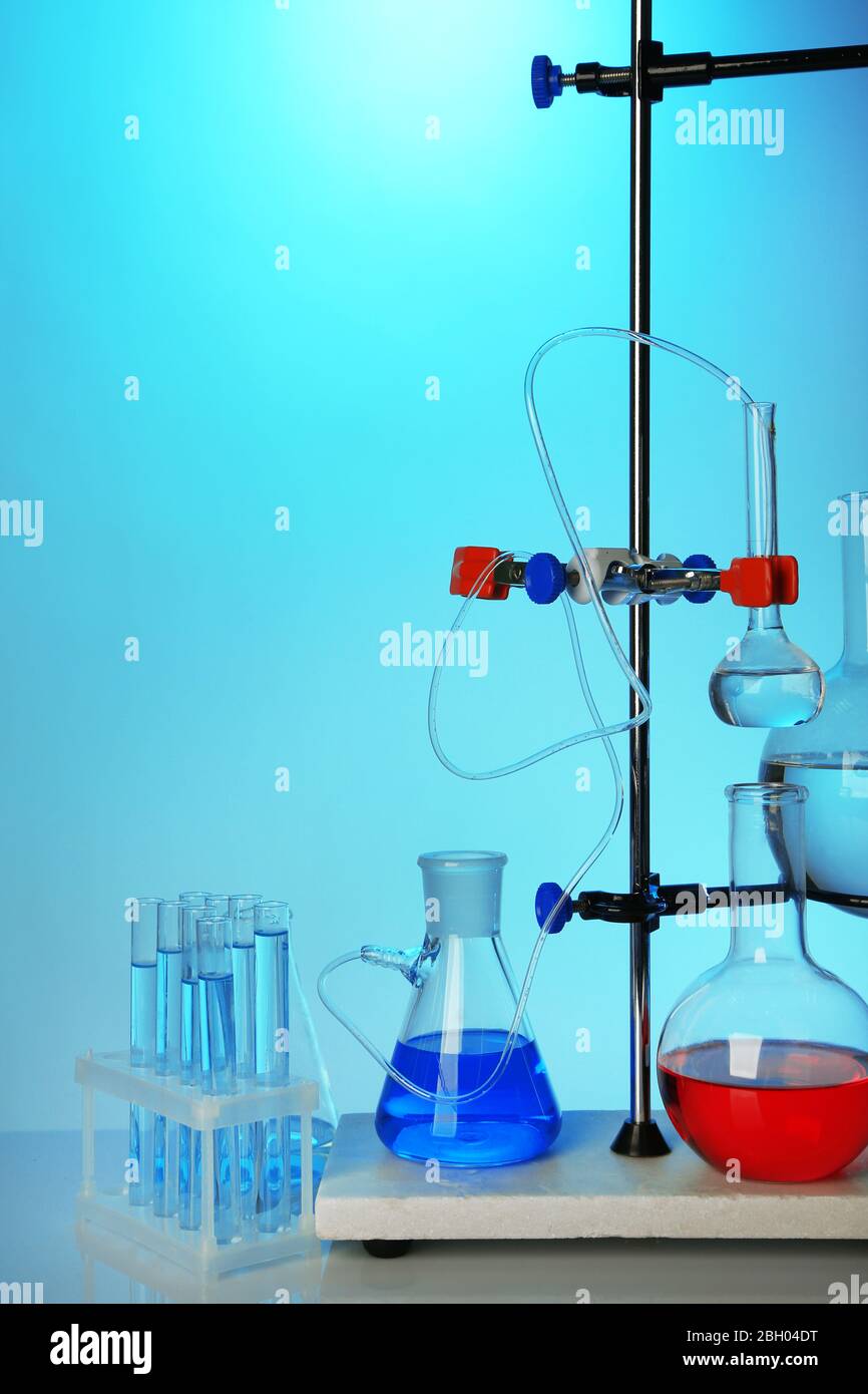 Fixed laboratory glassware on support on colorful background Stock ...