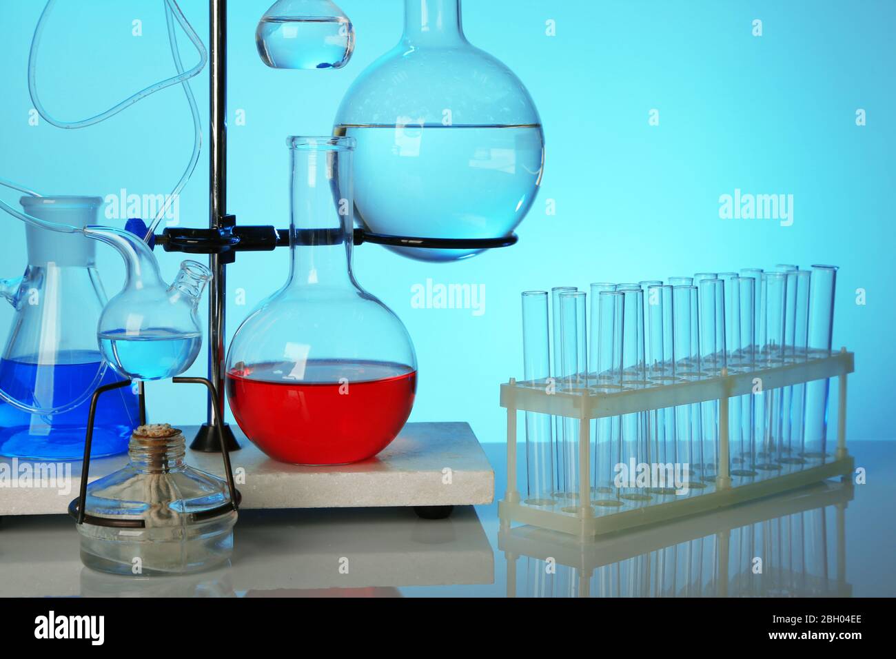 Fixed laboratory glassware on support on colorful background Stock ...