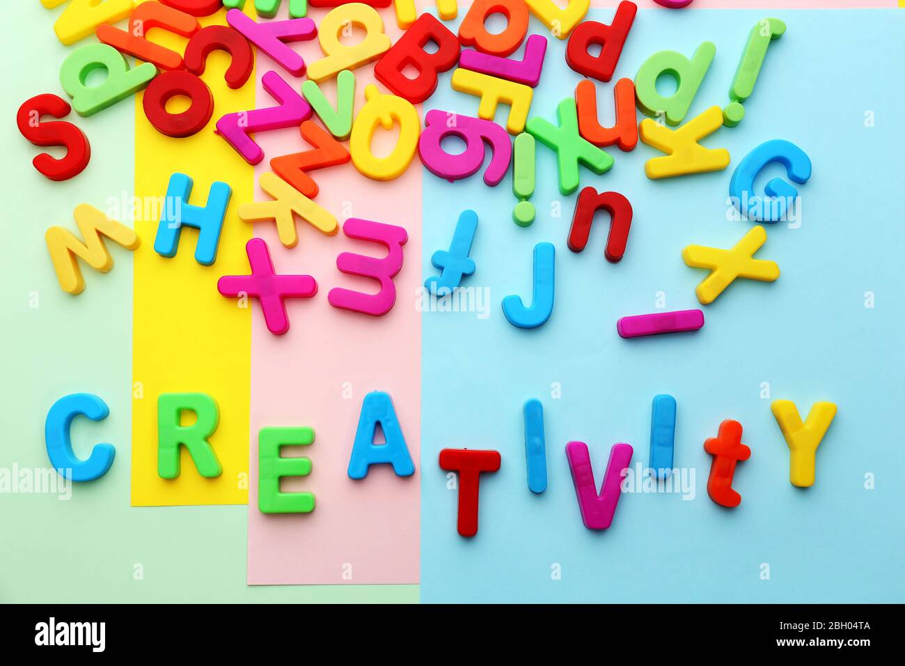 Creativity motto by alphabet letters on colorful sheets of paper ...