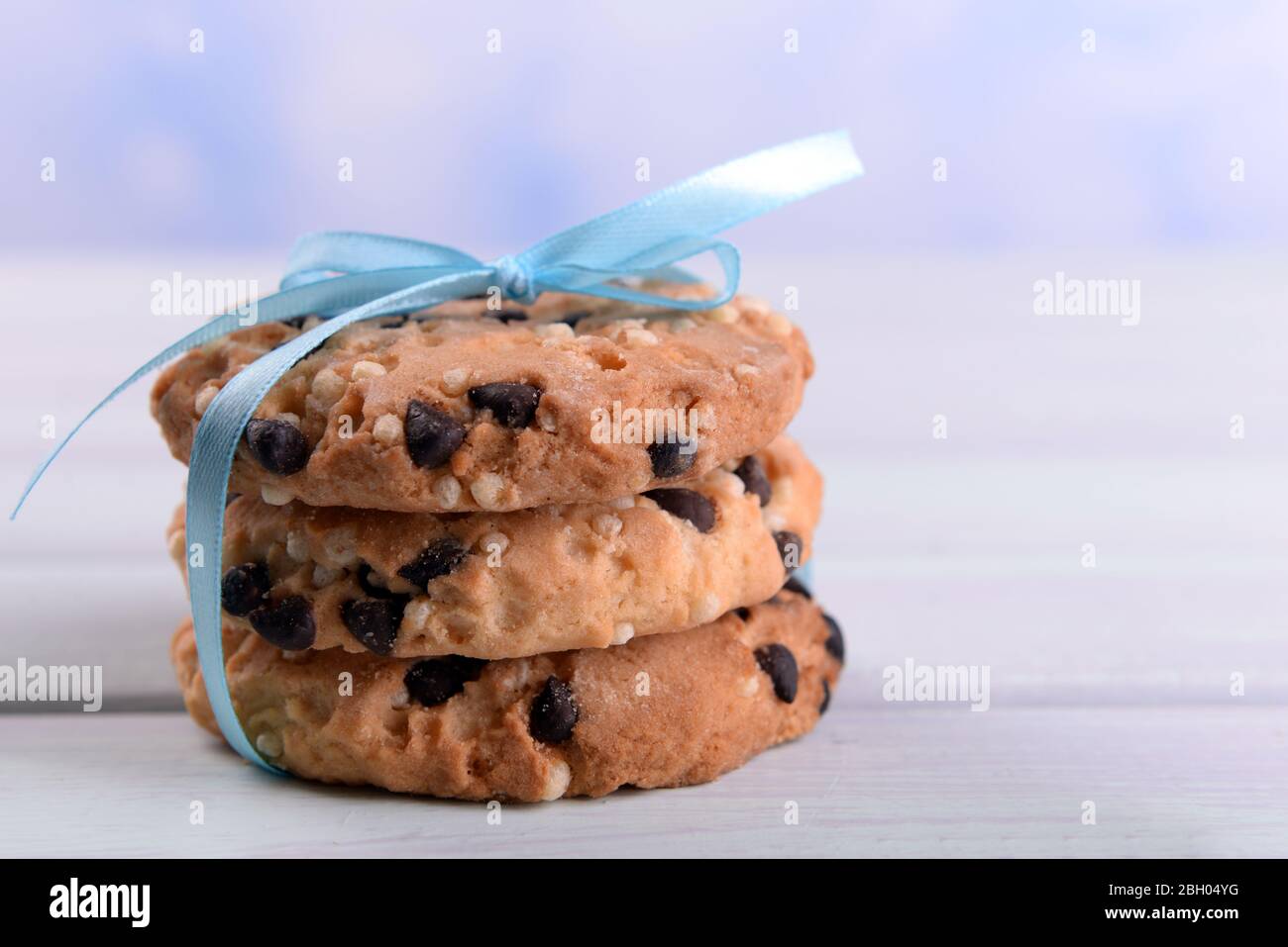 Tasty cookies on color wooden background Stock Photo - Alamy