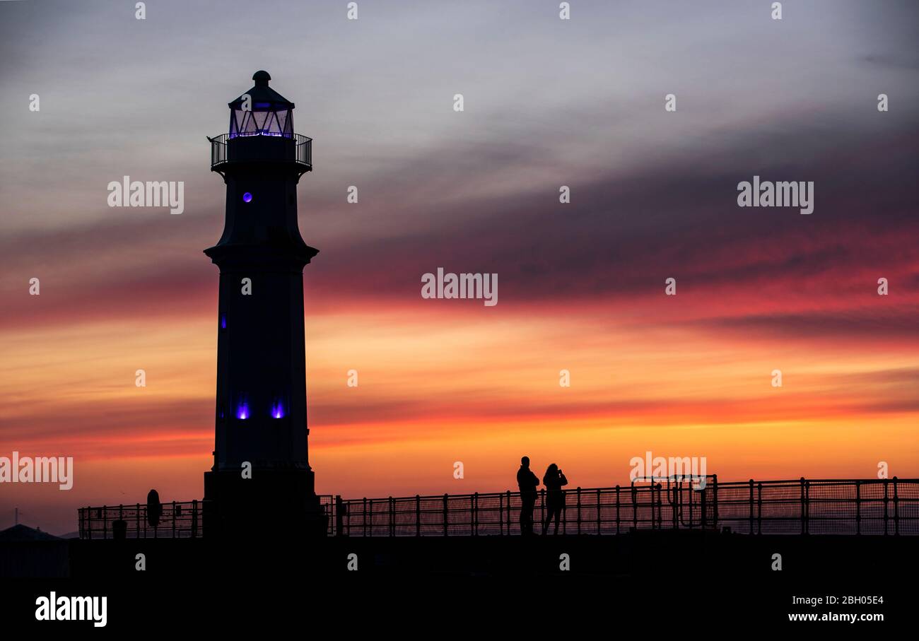 Sunset behind Newhaven lighthouse in Edinburgh Stock Photo - Alamy