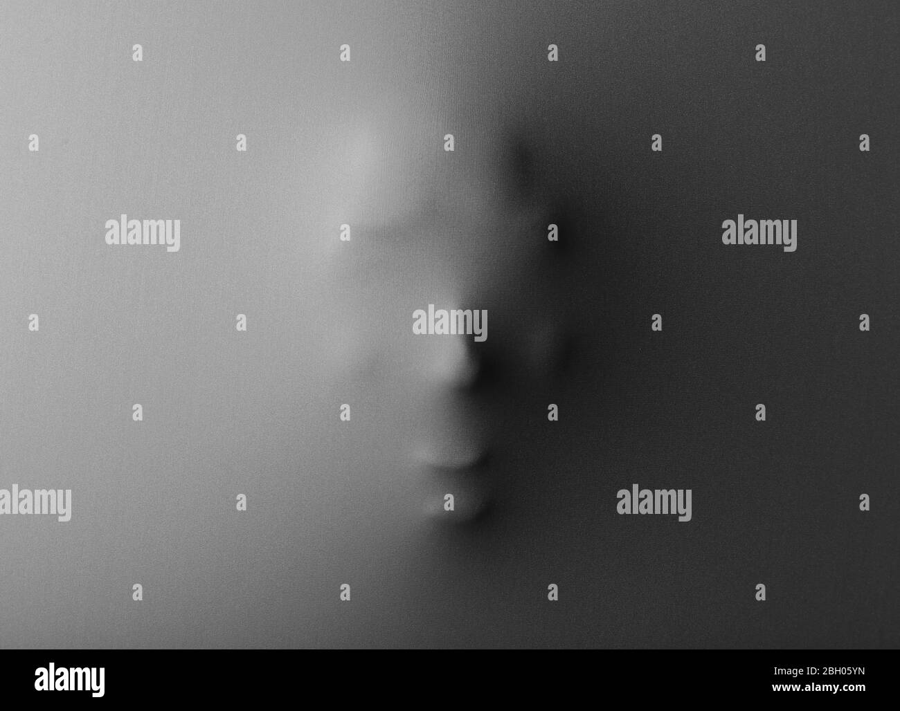 Human face pressing through fabric as horror background Stock Photo - Alamy