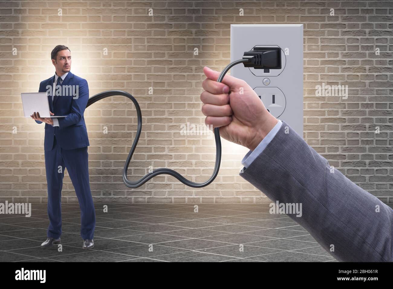 The businessman being powered by electricity and plug Stock Photo - Alamy
