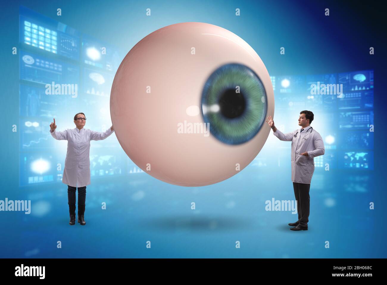 The doctor examining giant eye in medical concept Stock Photo - Alamy