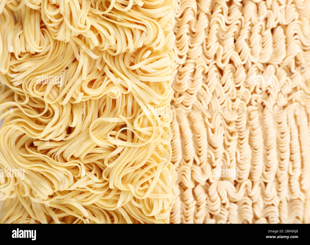 Different dry instant noodles close-up background Stock Photo - Alamy