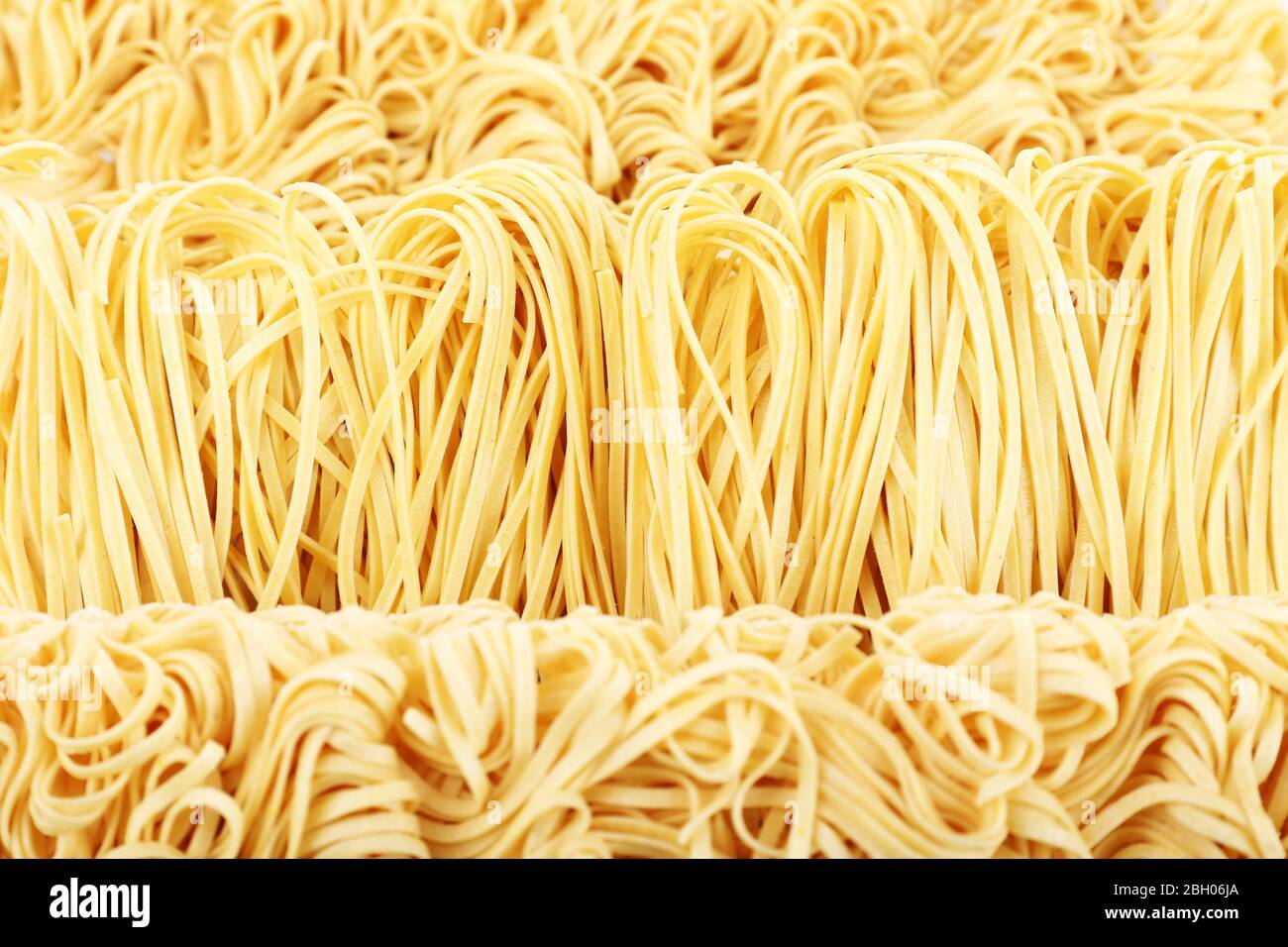 Different dry instant noodles close-up background Stock Photo - Alamy