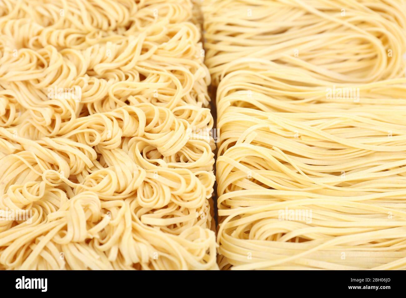 Different dry instant noodles close-up background Stock Photo - Alamy