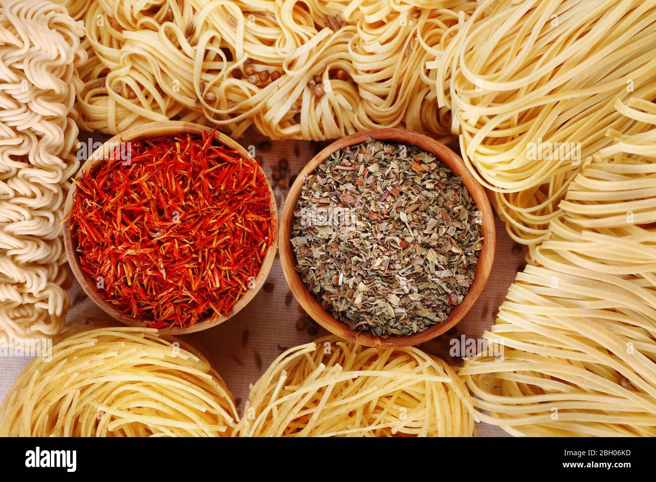Different dry instant noodles with spices close-up Stock Photo - Alamy