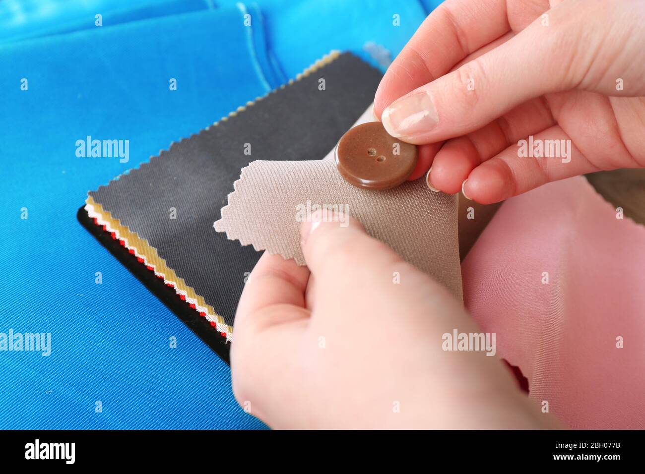 Colorful fabric samples and button in female hands, closeup view Stock ...