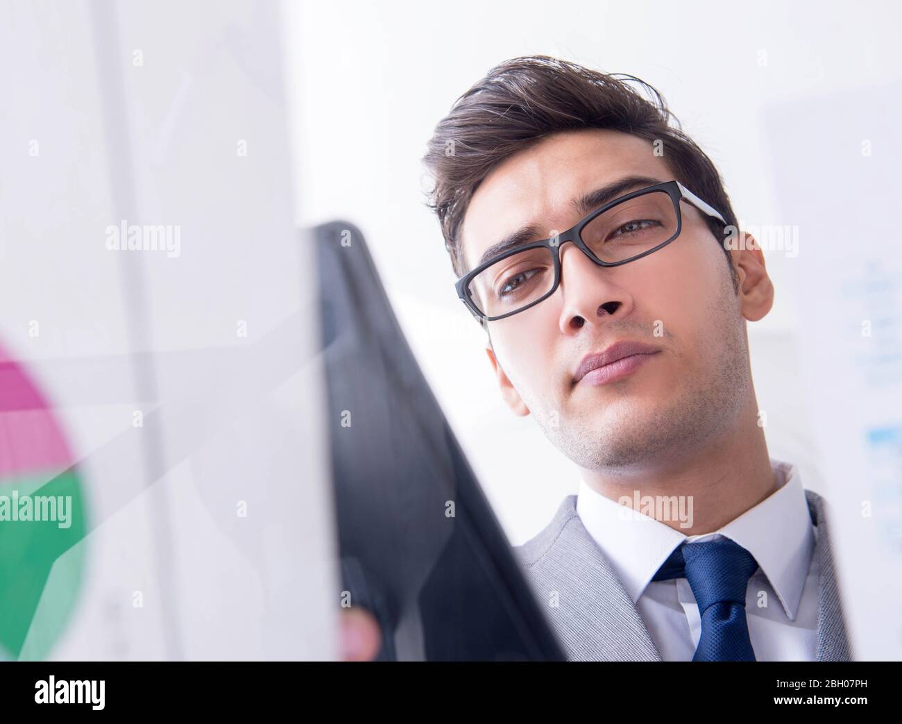 The businessman looking at financial charts and graphs Stock Photo - Alamy
