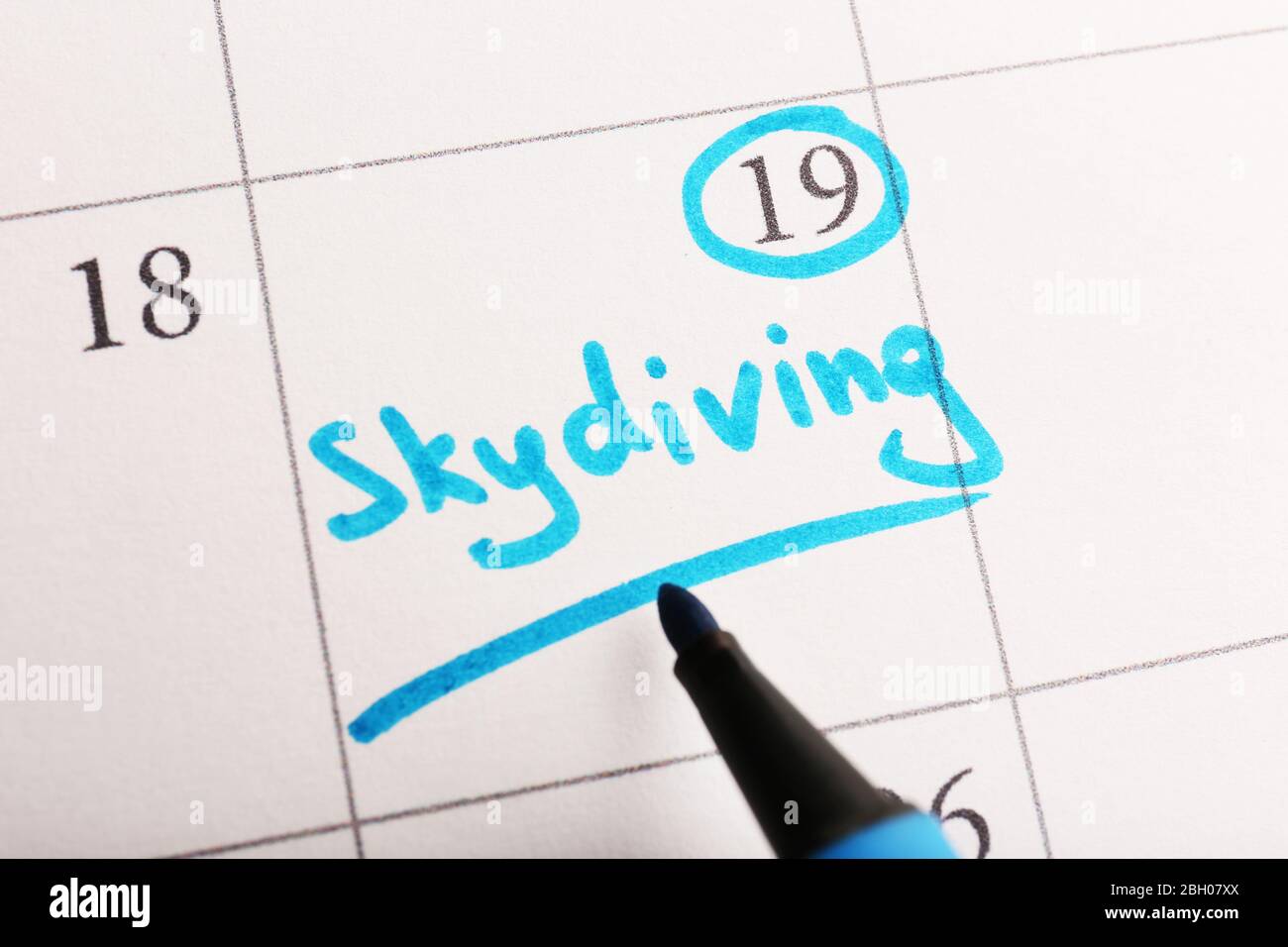 Written plan Skydiving on calendar page background Stock Photo - Alamy