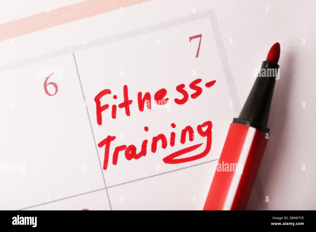 Written plan Fitness Training on calendar page background Stock Photo ...
