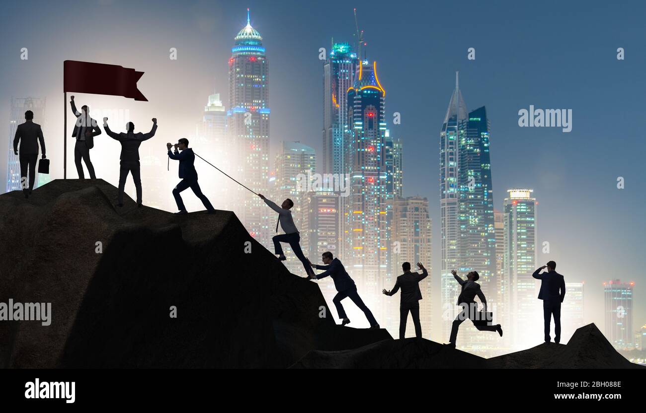 Concept of teamwork with team climbing mountain Stock Photo - Alamy