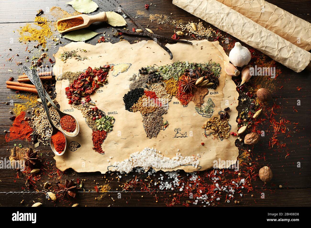 Map of world made from different kinds of spices on wooden background ...
