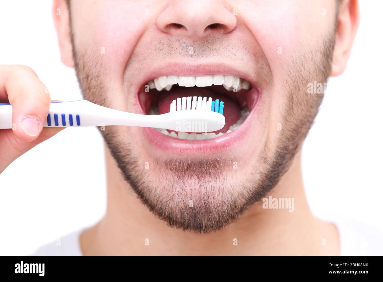 Man with toothbrush isolated on white Stock Photo - Alamy