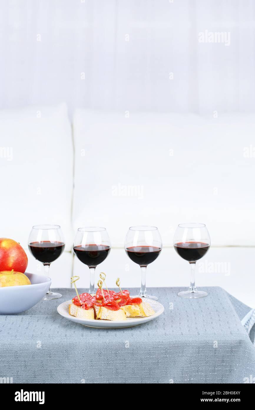 Table at home with food and drinks for friends Stock Photo - Alamy