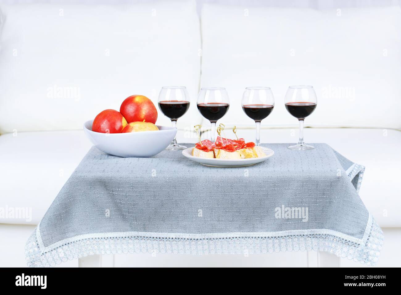 Table at home with food and drinks for friends Stock Photo - Alamy
