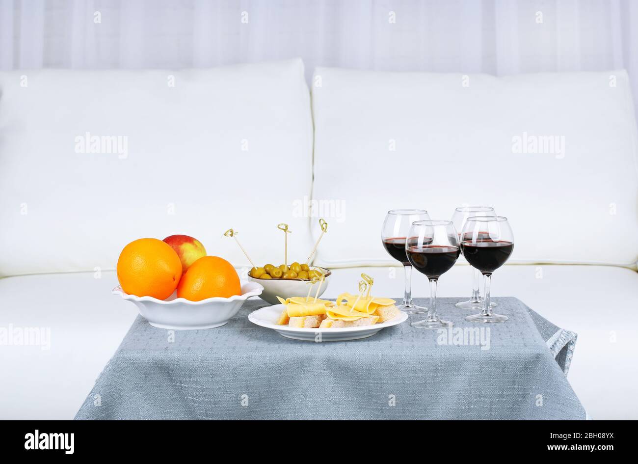 Table at home with food and drinks for friends Stock Photo - Alamy