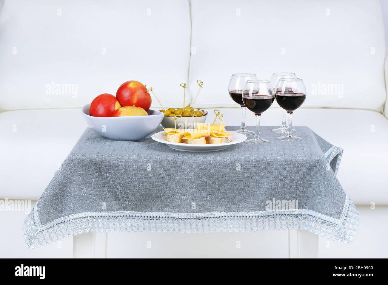 Table at home with food and drinks for friends Stock Photo - Alamy