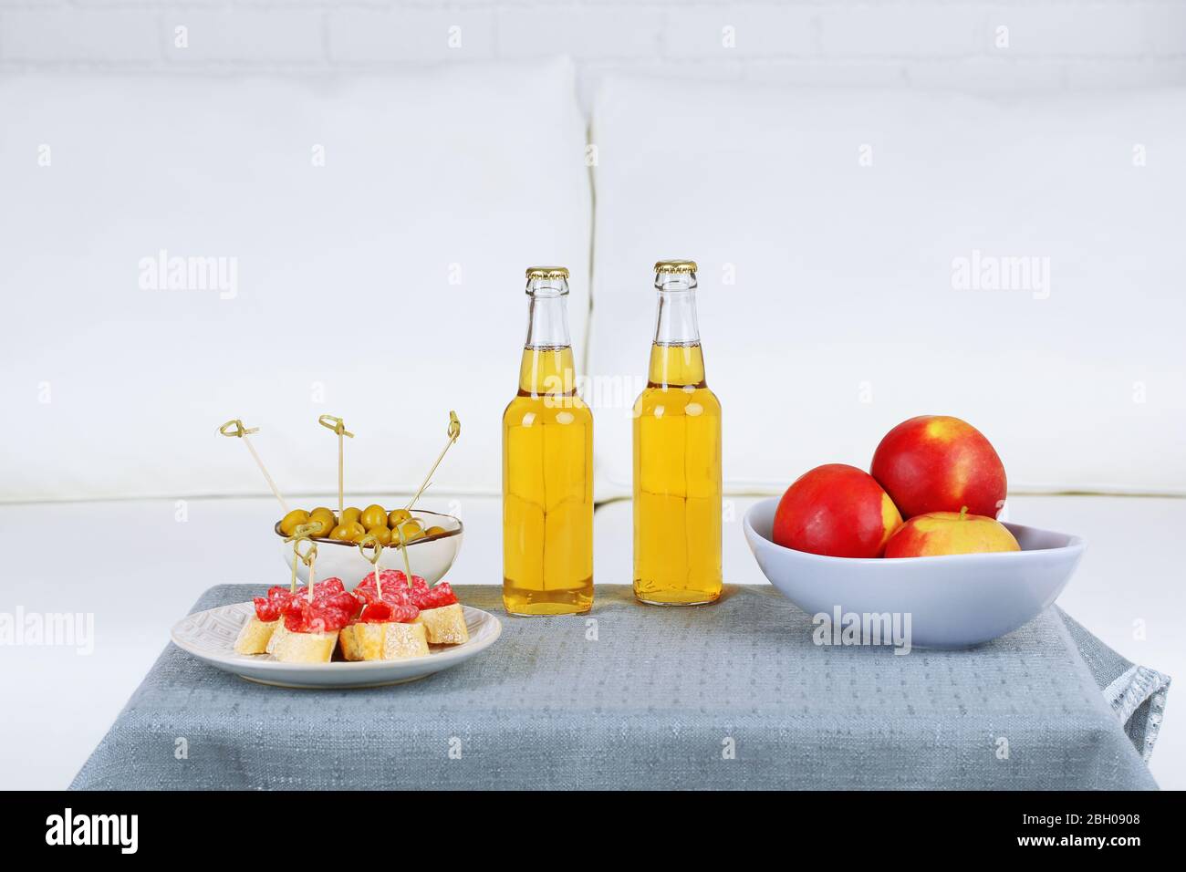 Table at home with food and drinks for friends Stock Photo - Alamy