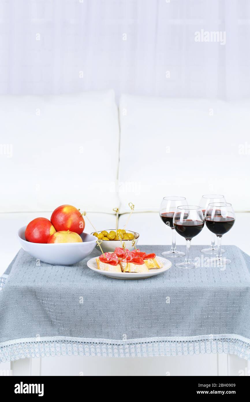 Table at home with food and drinks for friends Stock Photo - Alamy