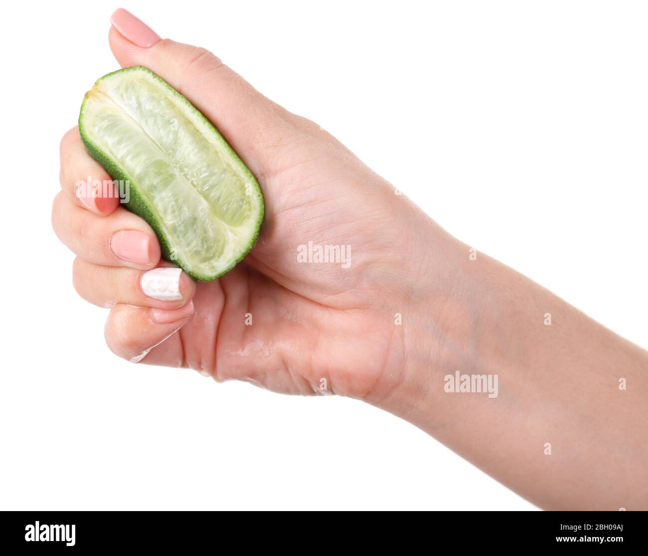 Female hand squeezing lime isolated on white Stock Photo - Alamy