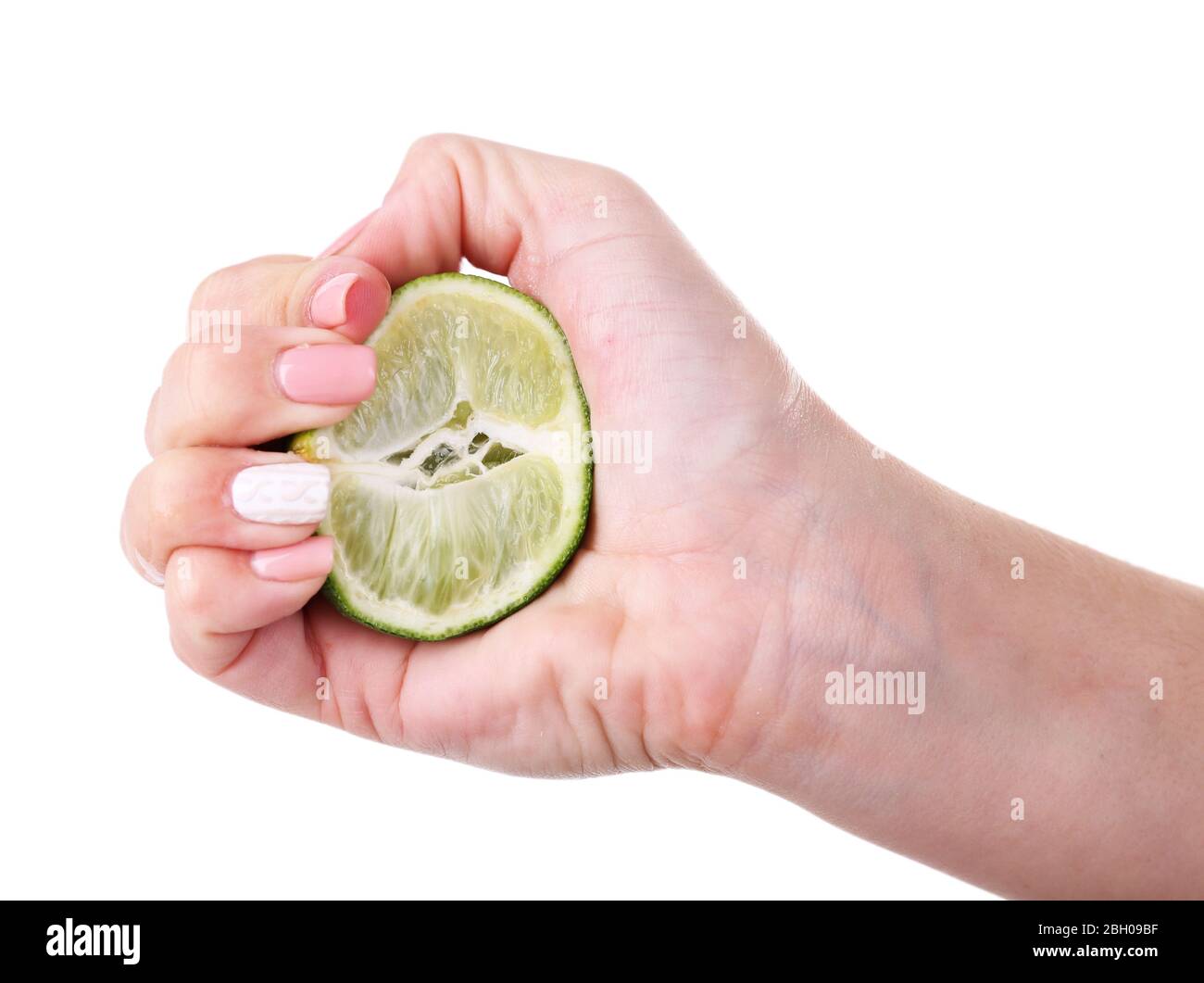 Female hand squeezing lime isolated on white Stock Photo - Alamy