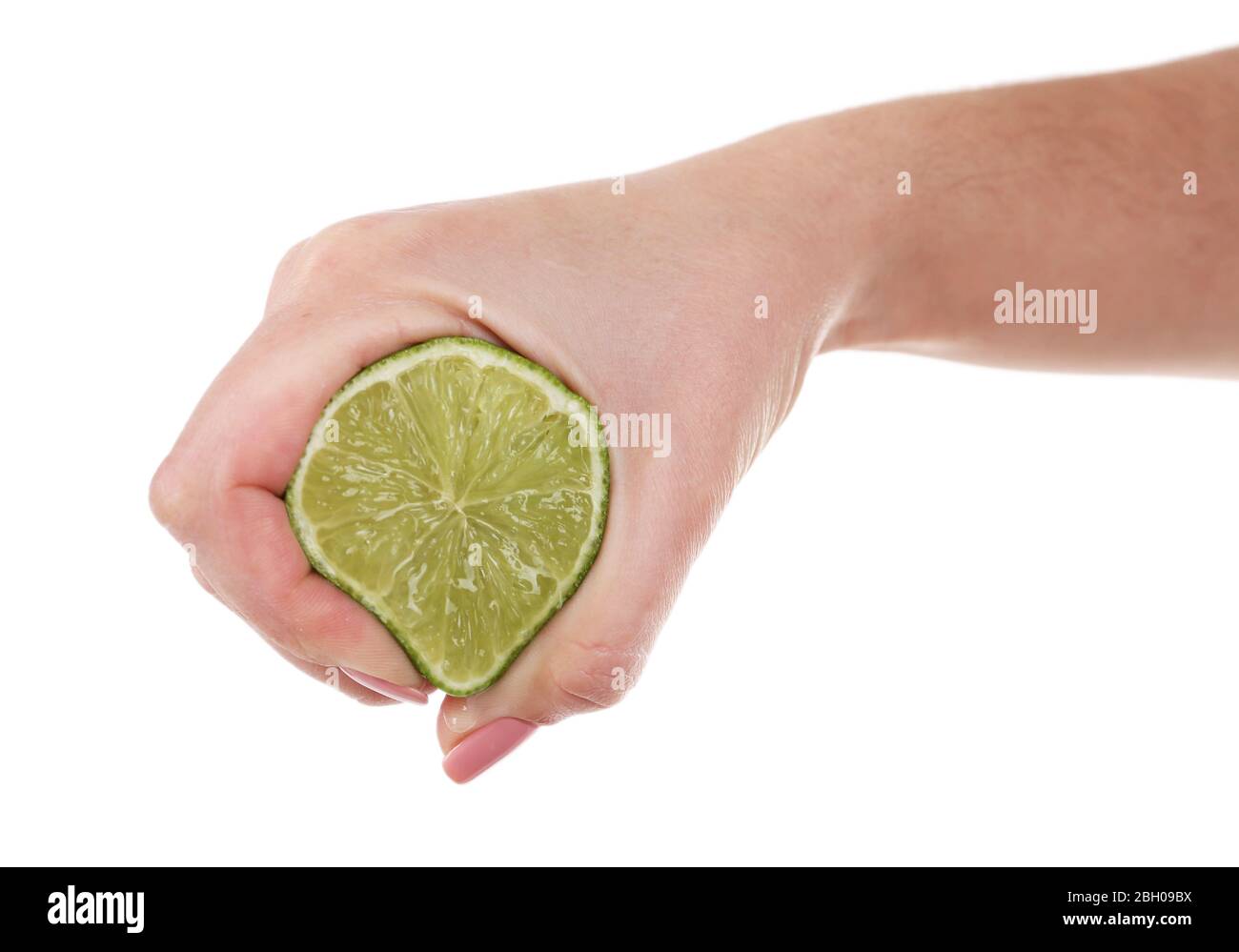 Female hand squeezing lime isolated on white Stock Photo - Alamy
