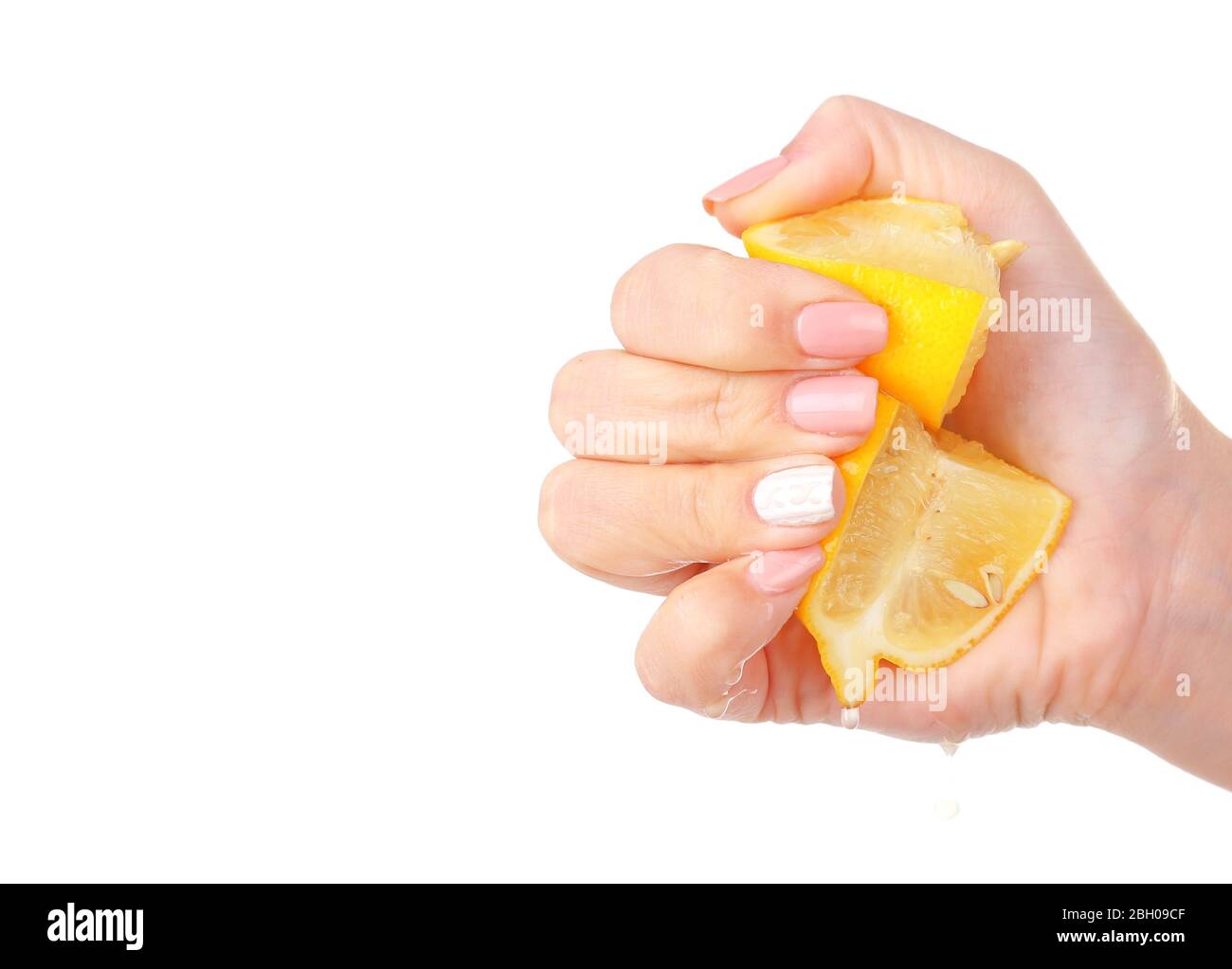 Female hand squeezing lemon isolated on white Stock Photo - Alamy