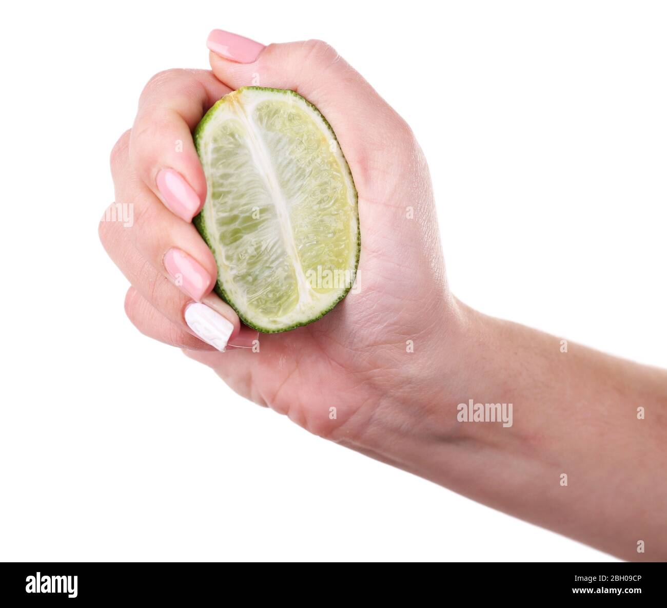 Female hand squeezing lime isolated on white Stock Photo - Alamy