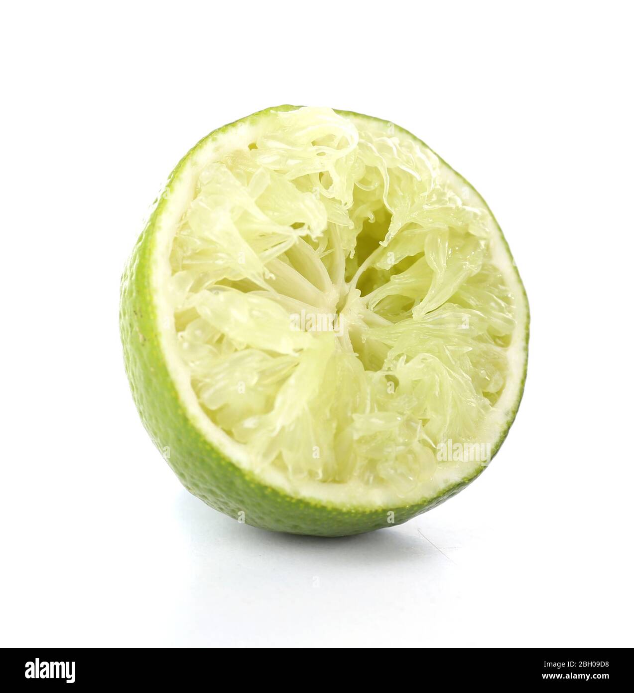Squeezed lime isolated on white Stock Photo - Alamy