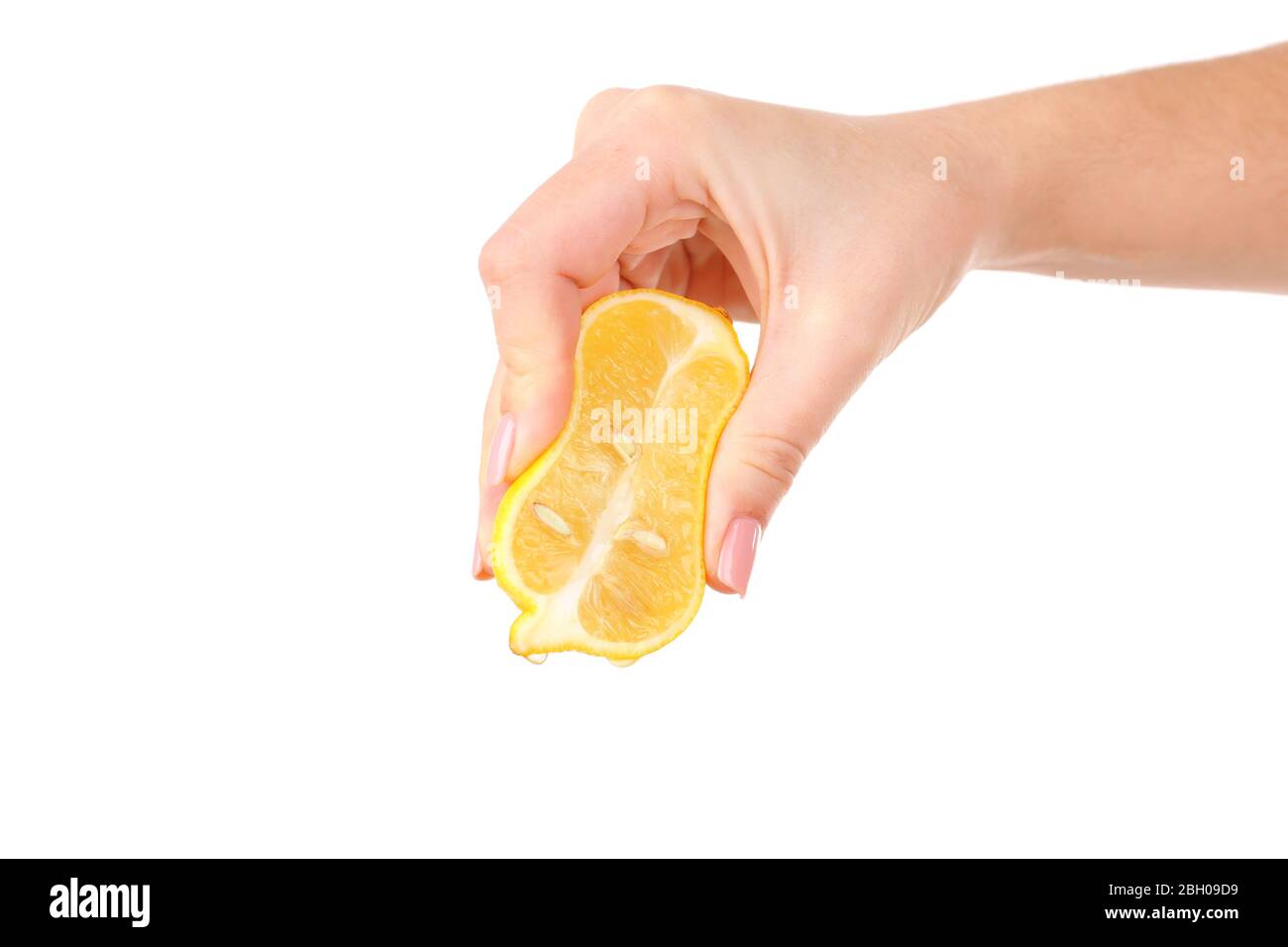 Female hand squeezing lemon isolated on white Stock Photo - Alamy
