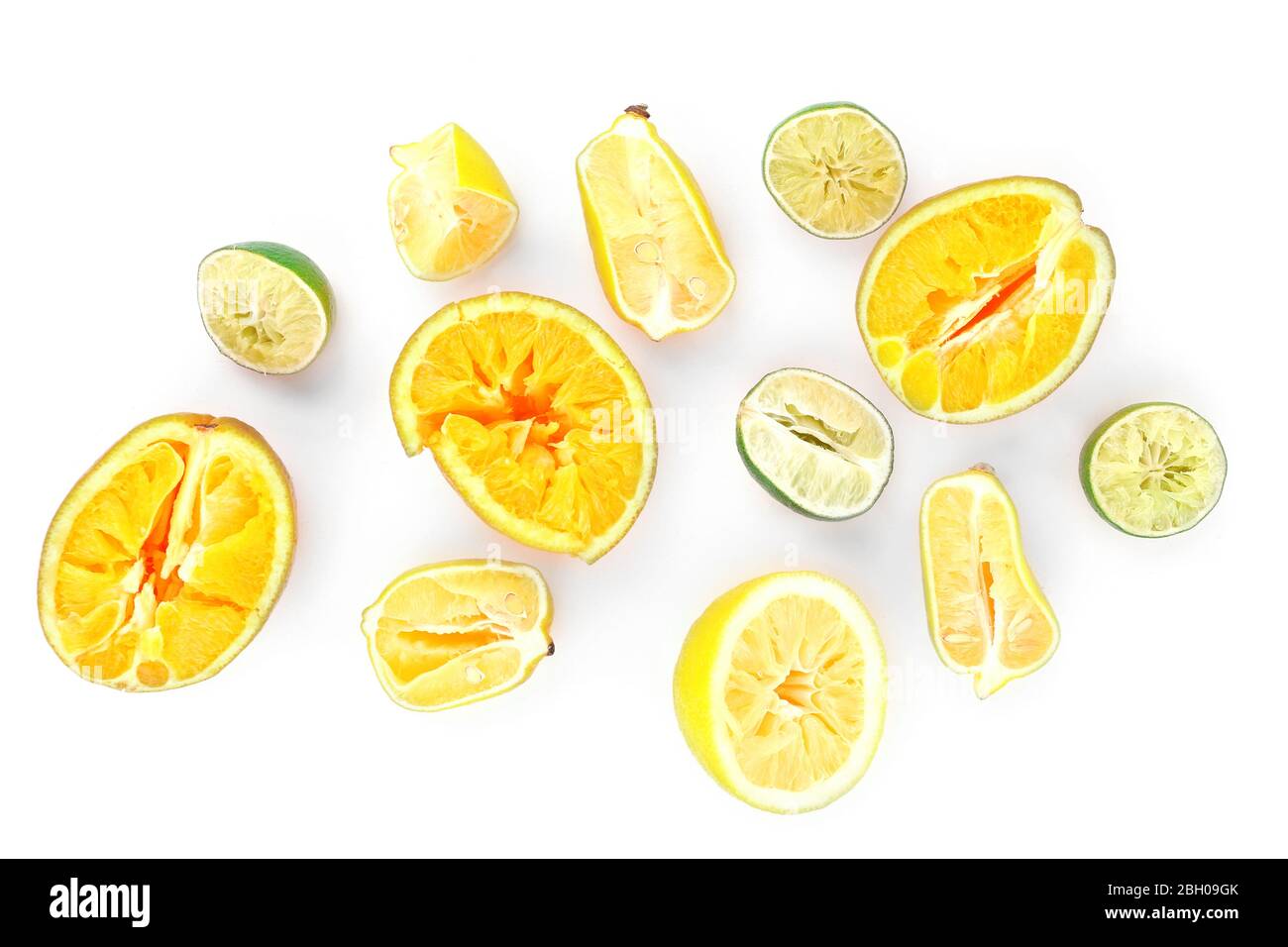 Squeezed citrus fruits isolated on white Stock Photo - Alamy