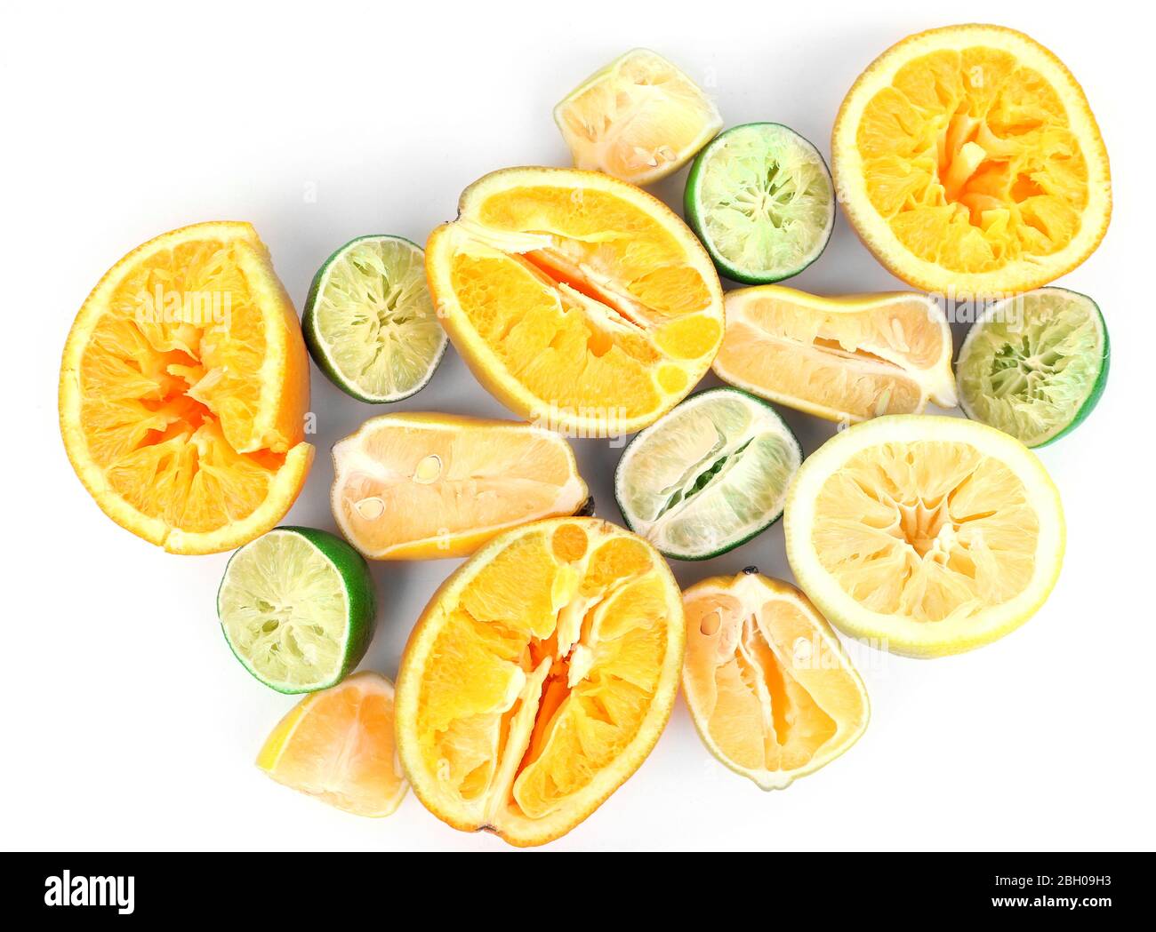 Squeezed citrus fruits isolated on white Stock Photo - Alamy