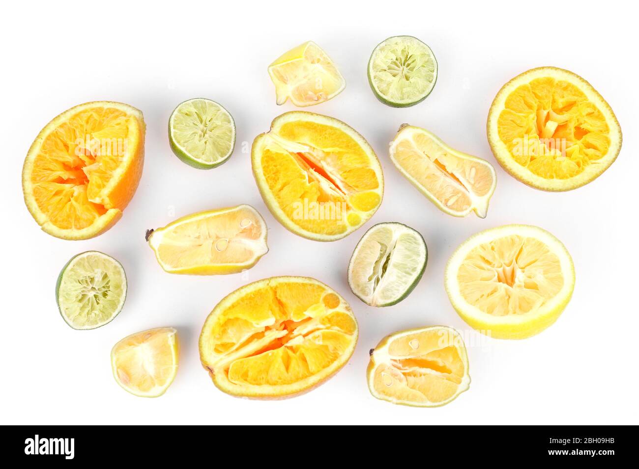 Squeezed citrus fruits isolated on white Stock Photo - Alamy