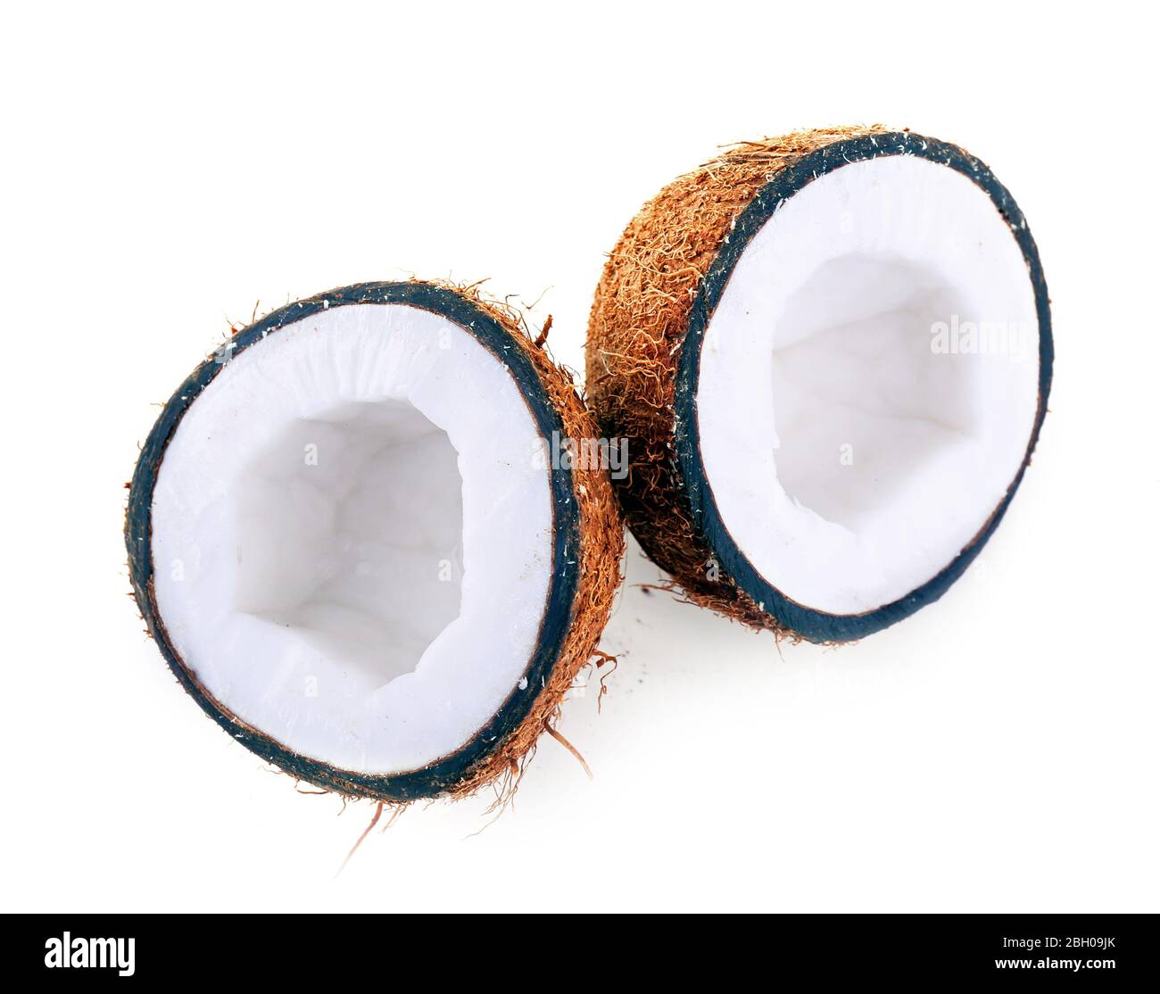 Coconut cut in half isolated on white background Stock Photo - Alamy