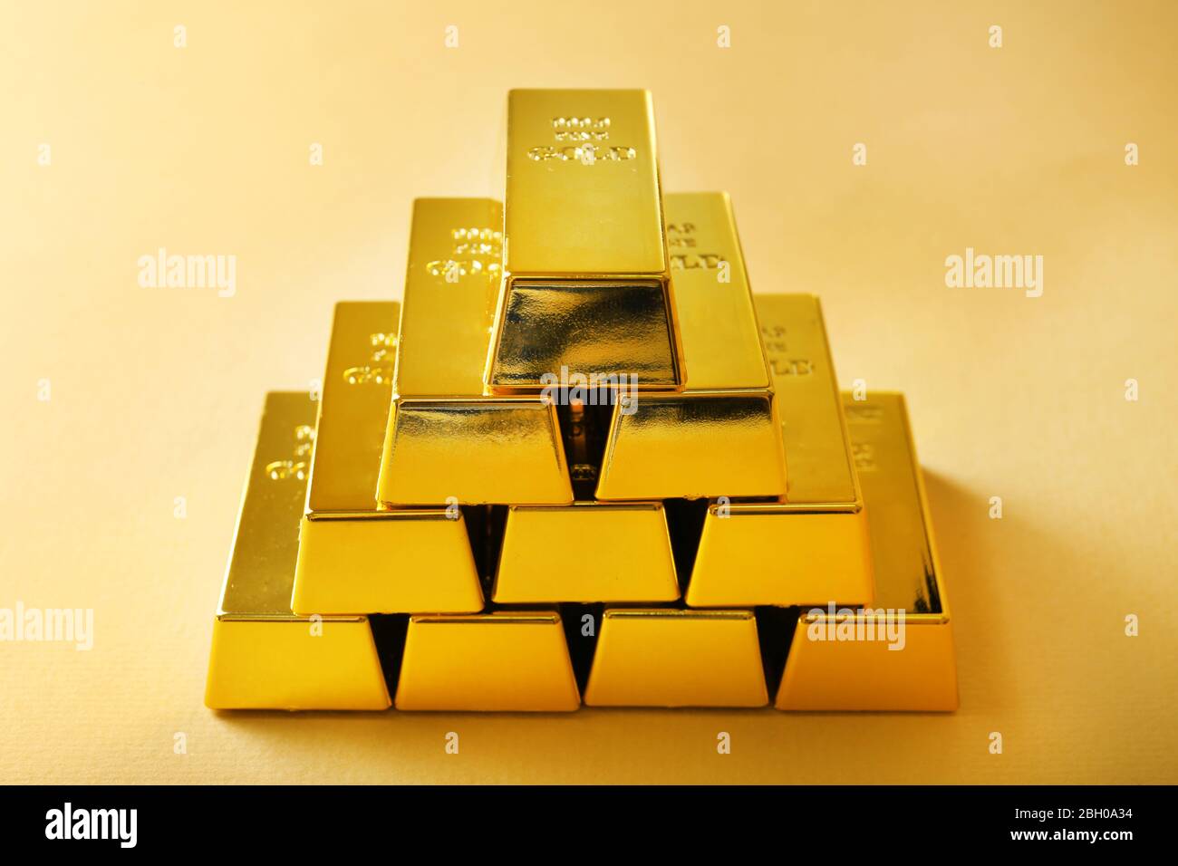 Gold bars isolated on white Stock Photo - Alamy