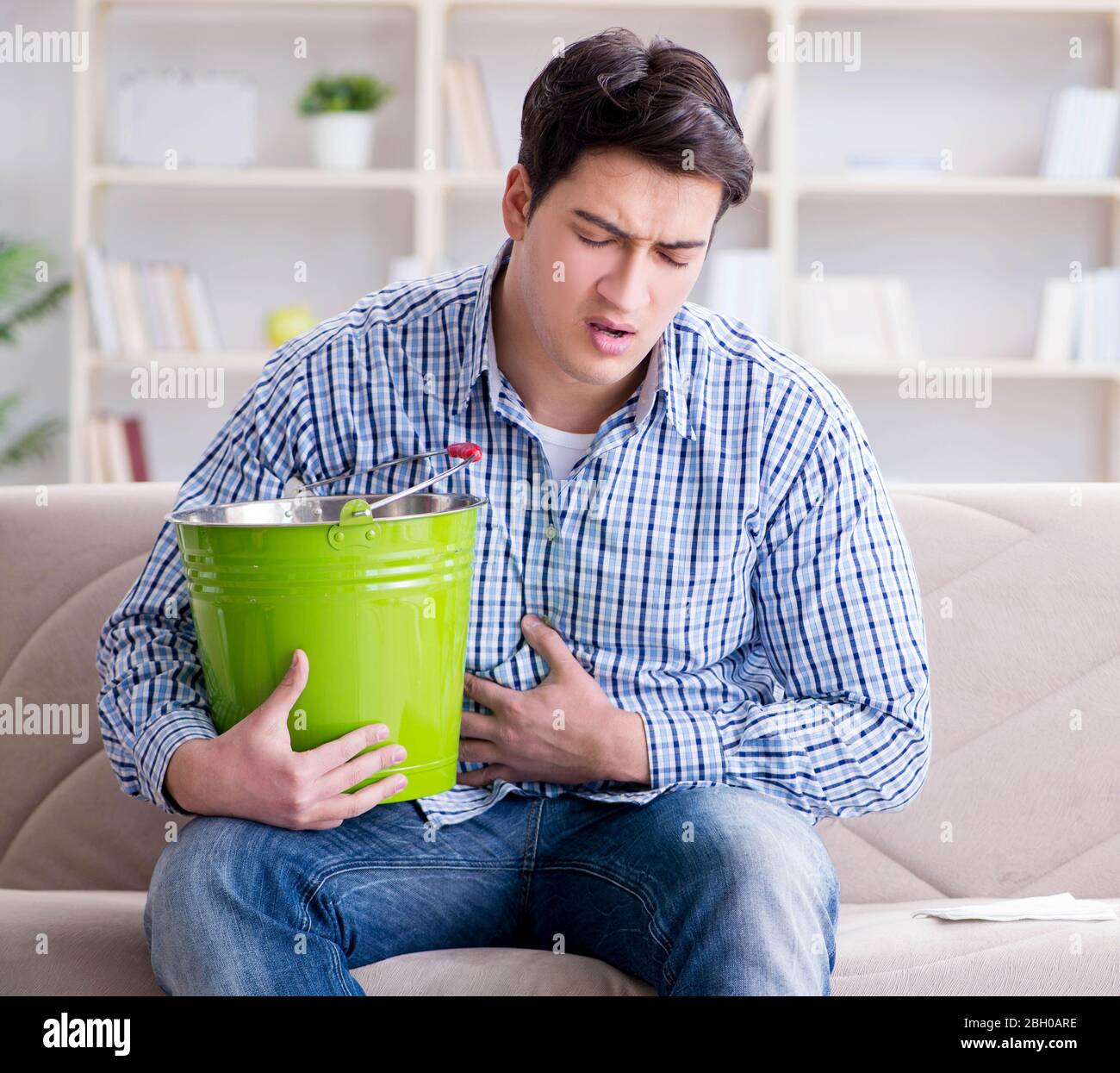 The sick man suffering at home from infection and bad stomach Stock ...