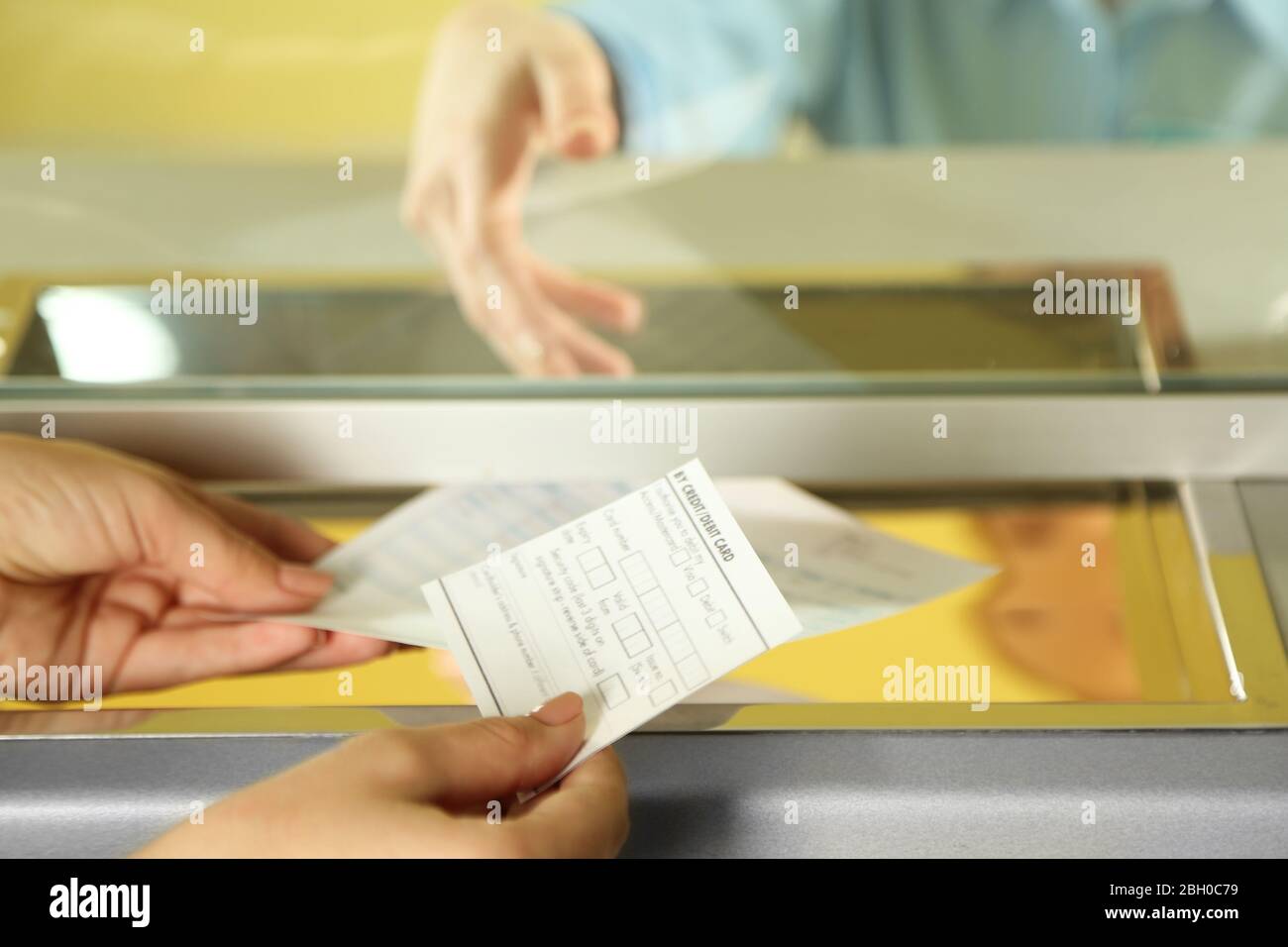 Teller window with working cashier. Concept of payment of utilities ...