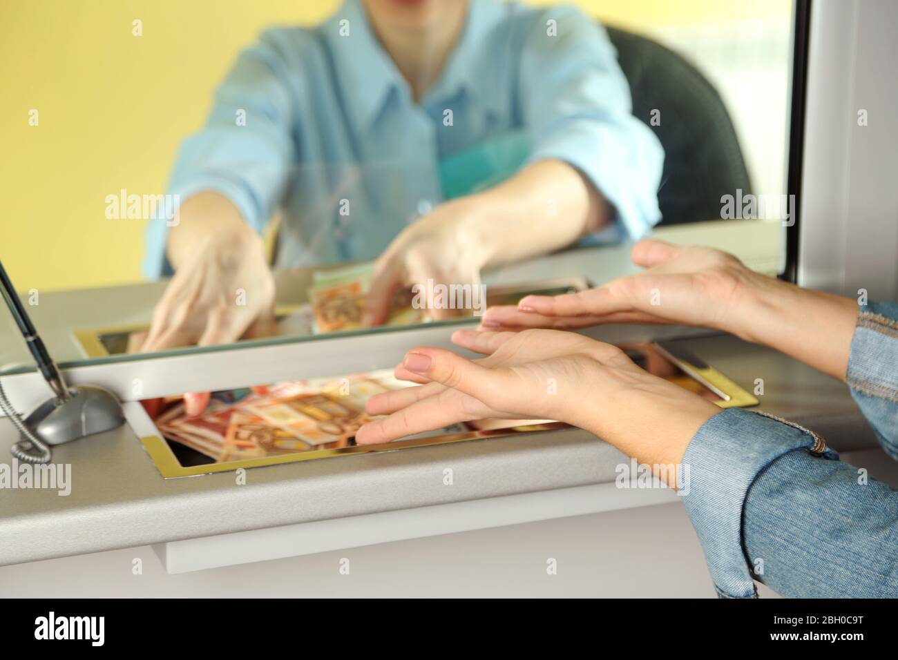Teller window with working cashier. Currency exchange concept Stock ...