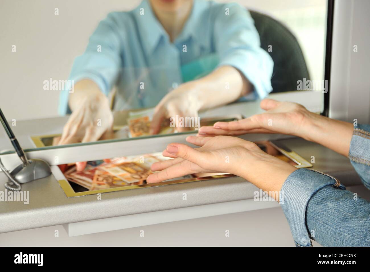 Teller window with working cashier. Currency exchange concept Stock ...